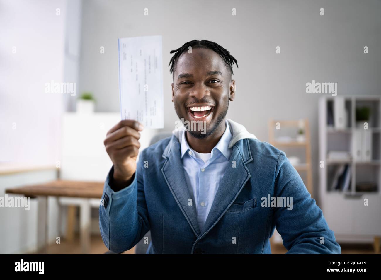 Holding Paycheck Or Payroll Check Or Insurance Cheque In Hand Stock ...