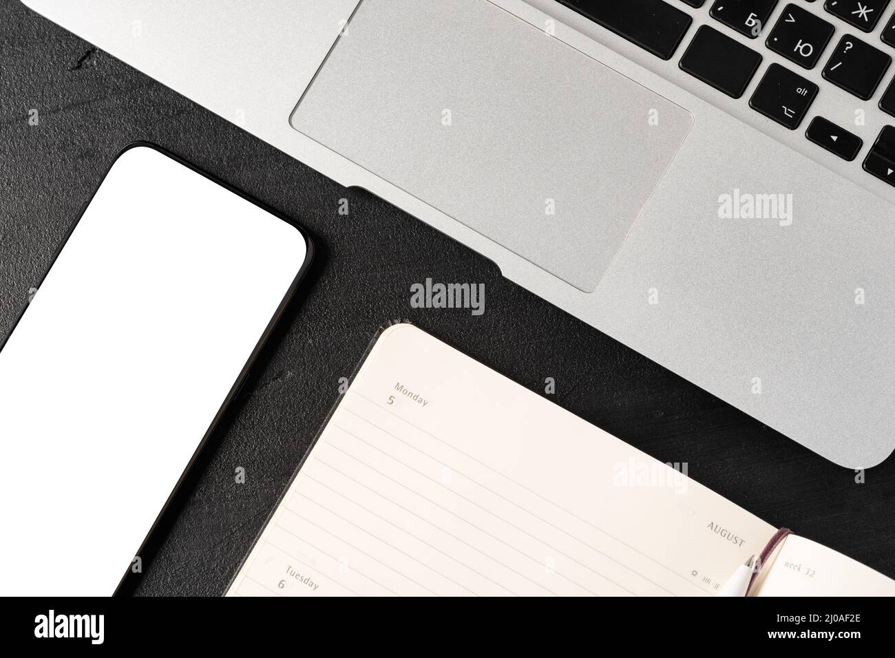 Notepad is on top of office desk table with laptop and supplies Stock ...