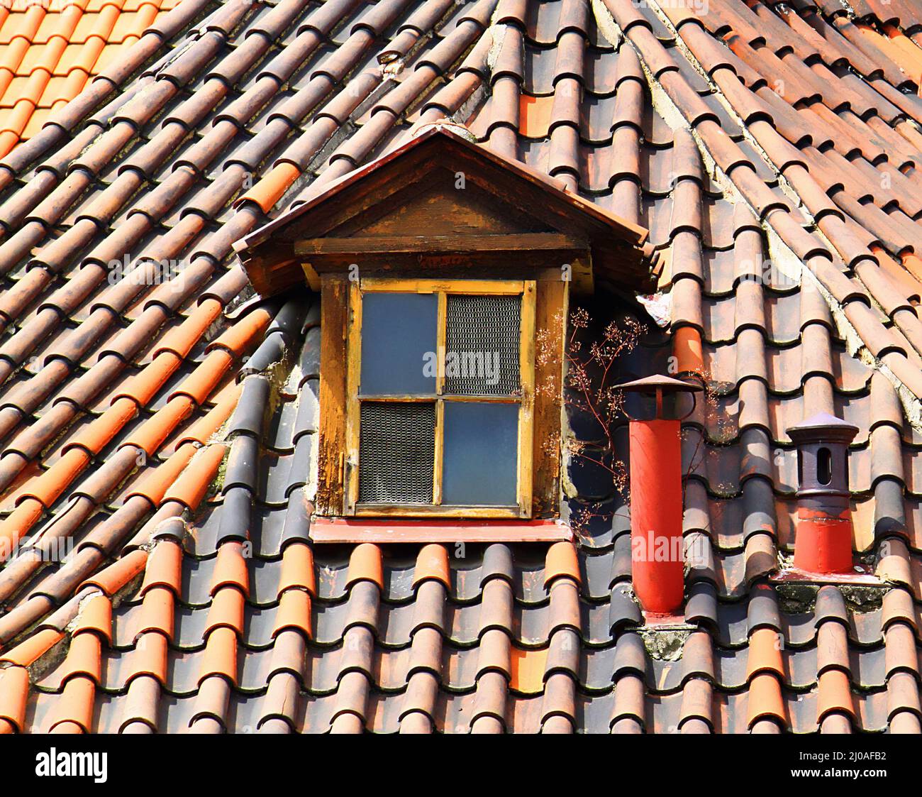 Old tiles roof and window Stock Photo - Alamy