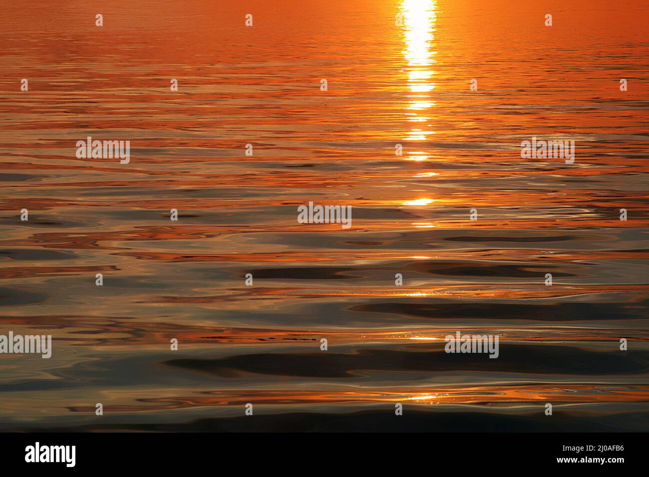 Sunset water background Stock Photo - Alamy