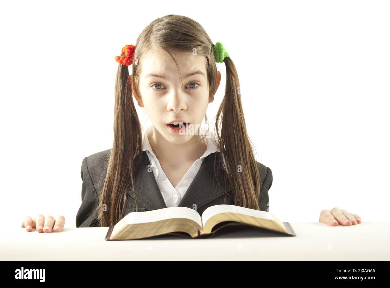 Surprised teen girl with the Bible Stock Photo - Alamy