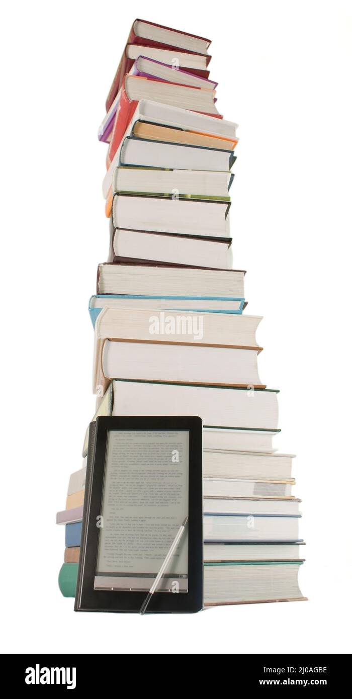 Tall stack of books and e-book reader on the white Stock Photo - Alamy