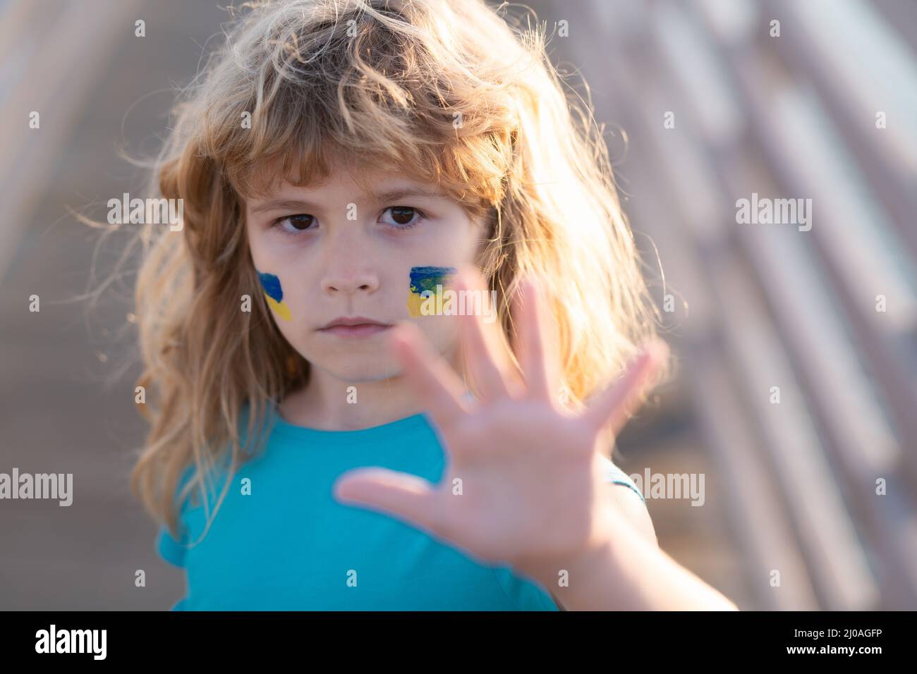 Portrait of child boy calls to Stop war in Ukraine, Stop the war hand ...