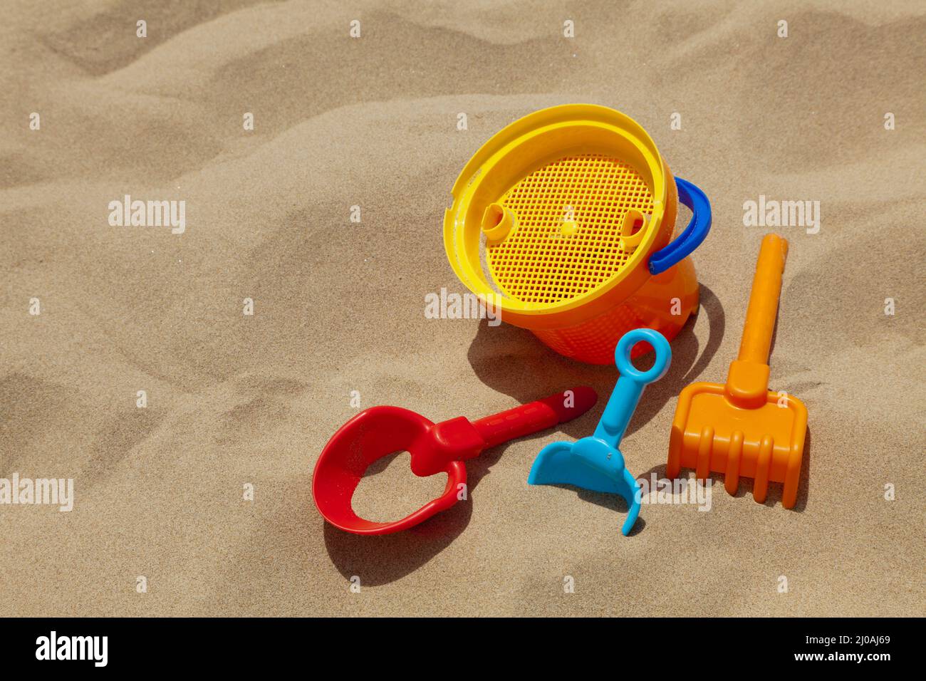 Children's beach toys - buckets, spade and shovel Stock Photo - Alamy