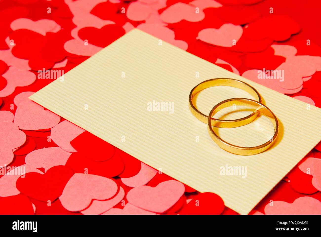 Two rings and a card with marriage proposal Stock Photo - Alamy