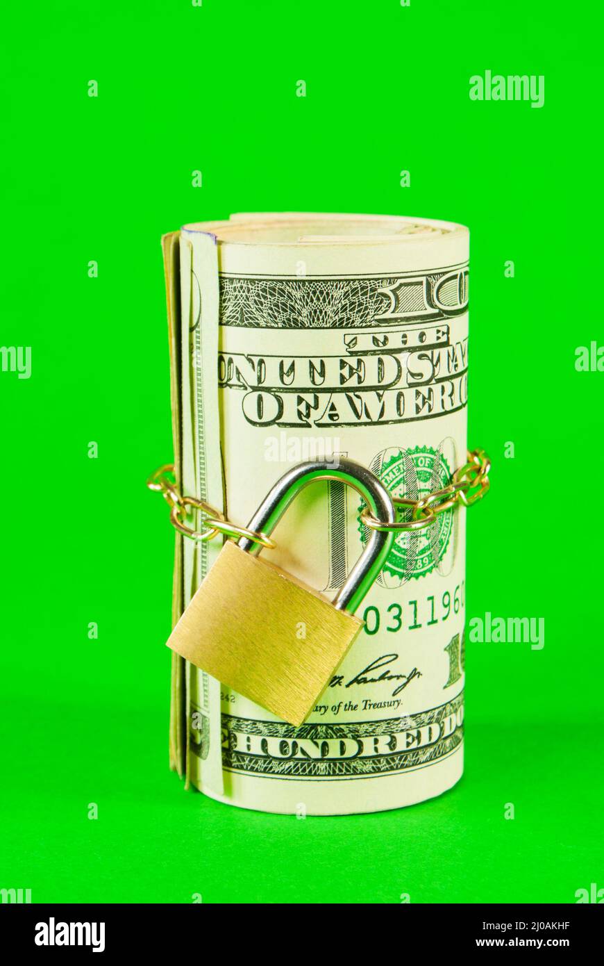 Roll of US dollars chained and locked Stock Photo - Alamy