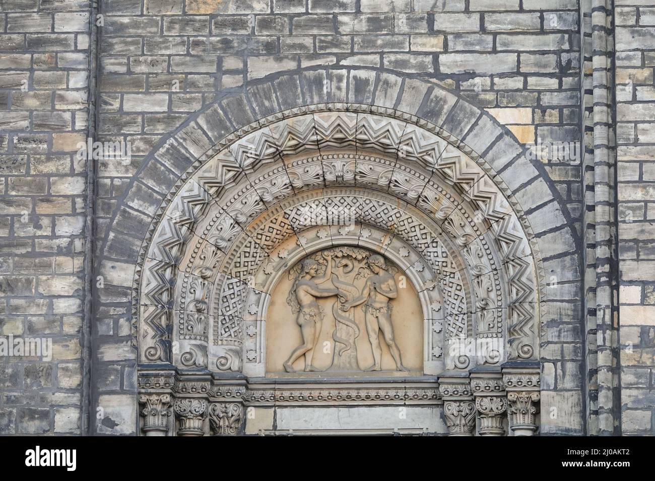 Relief with the Adam and Eve. Neo-romanesque portal of old Saint Cyril ...