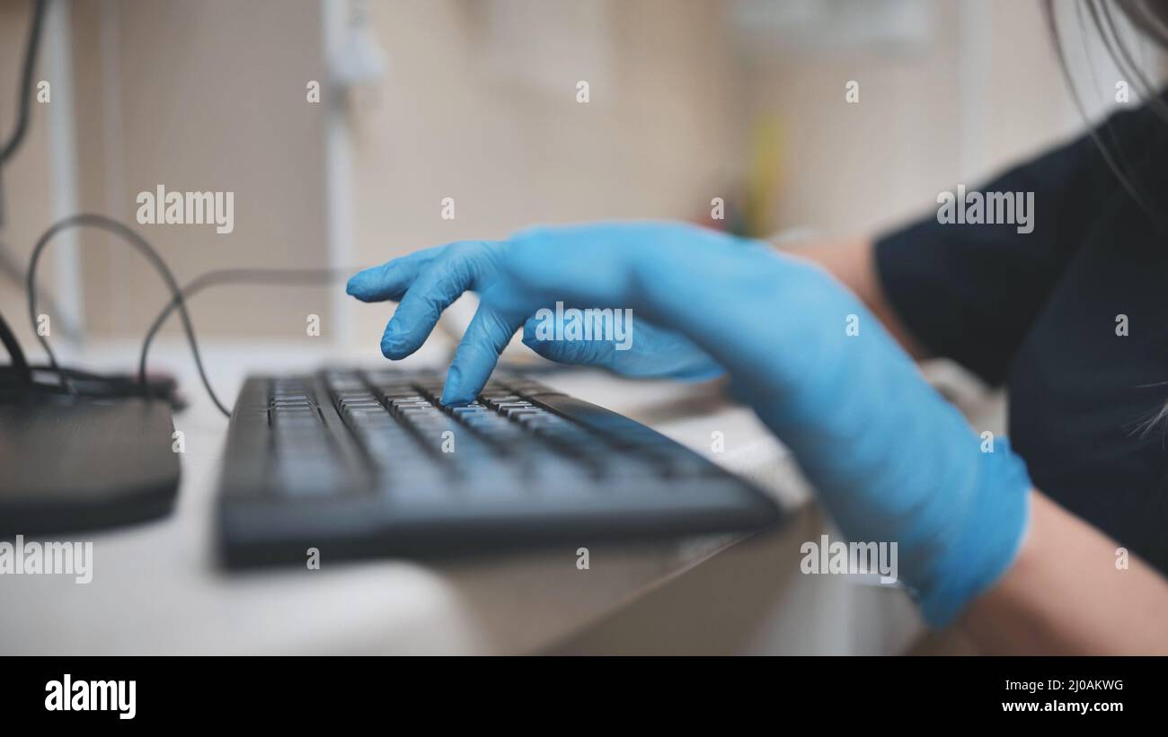 Typing laptop hands doctor hi-res stock photography and images - Alamy