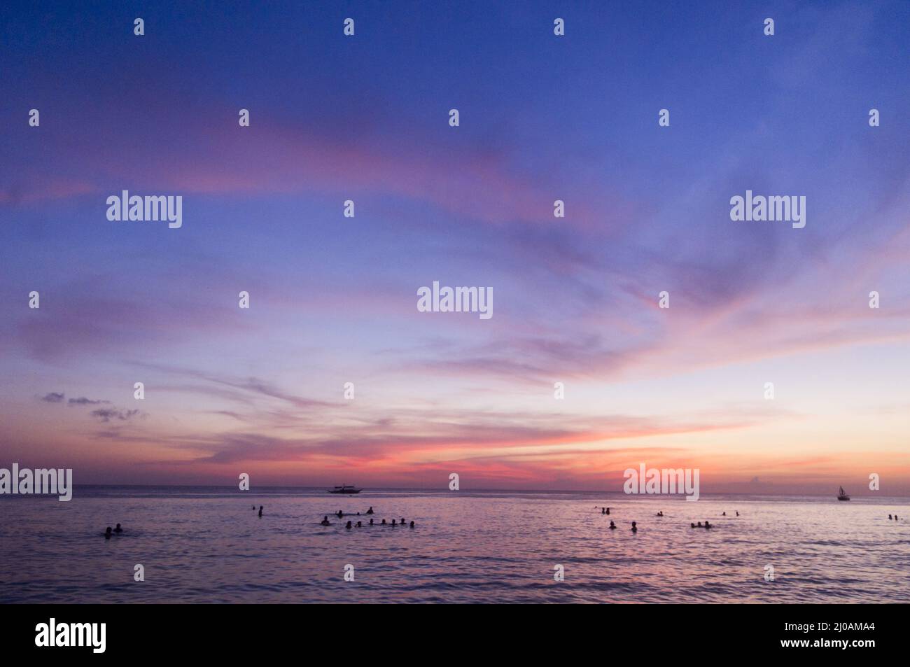 Sunset on beach Stock Photo - Alamy