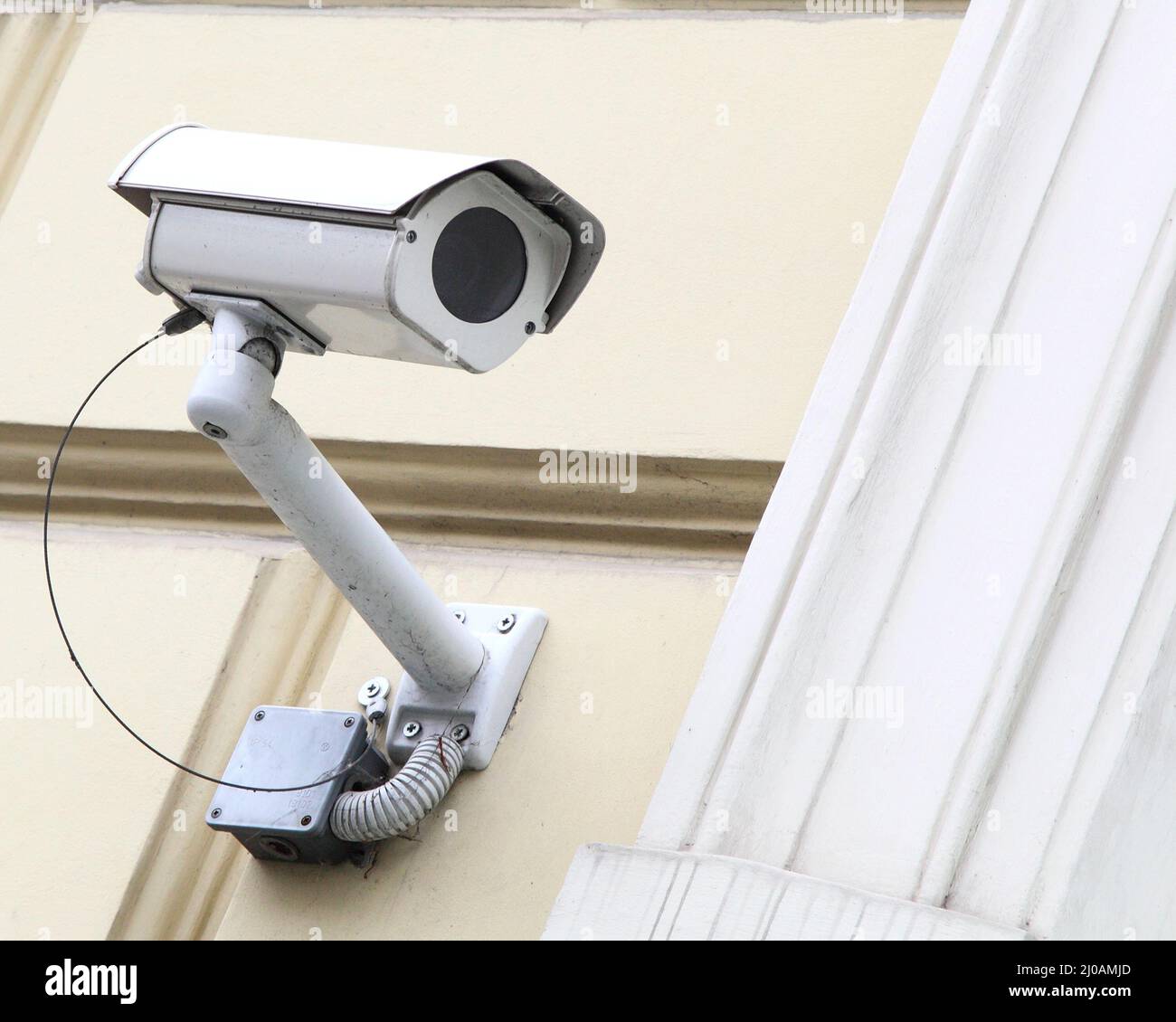 Surveillance camera hanging on the wall hi-res stock photography and ...