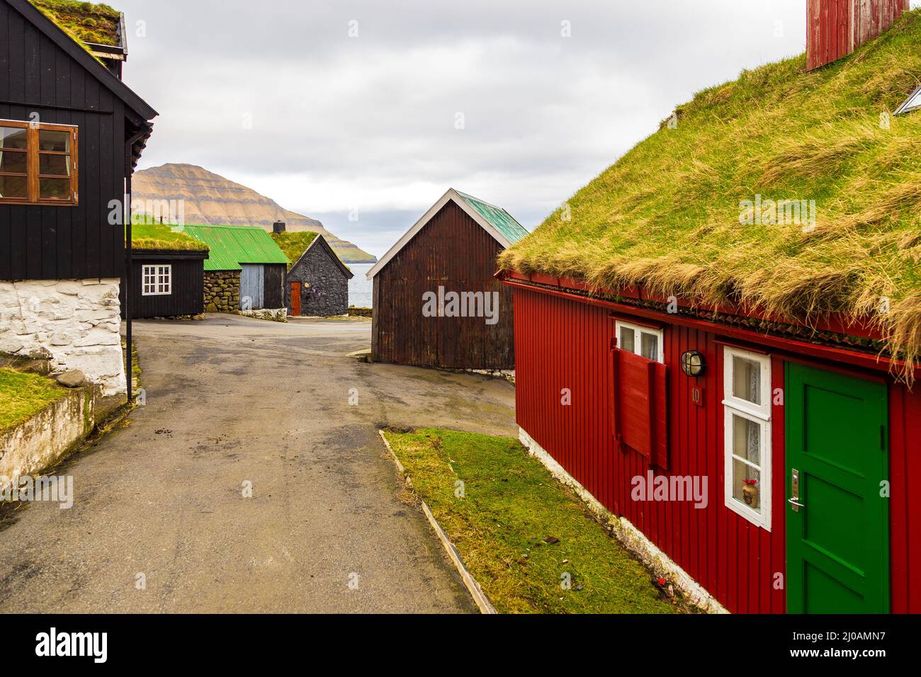 Small village Elduvik situated on the slope of the mountain on Eysturoy ...