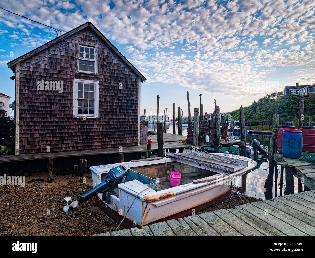 Fishing house with boat Stock Photo - Alamy
