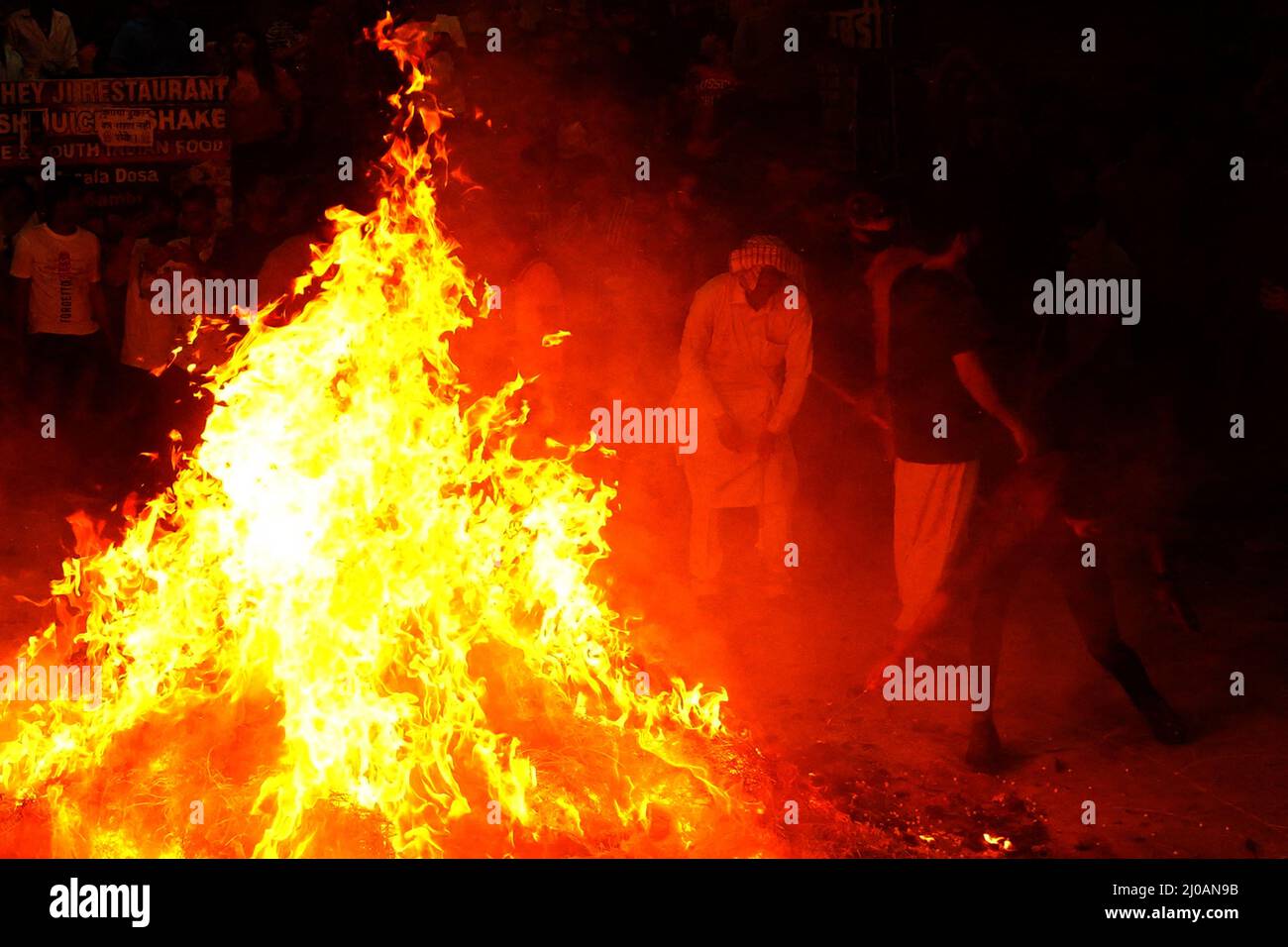 Rajasthan, India. 17th Mar, 2022. Indian People gather around the ...