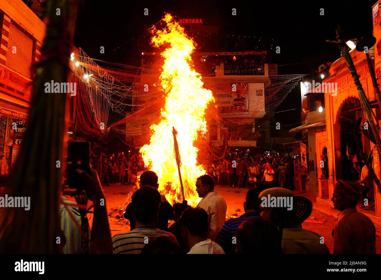 Rajasthan, India. 17th Mar, 2022. Indian People gather around the ...