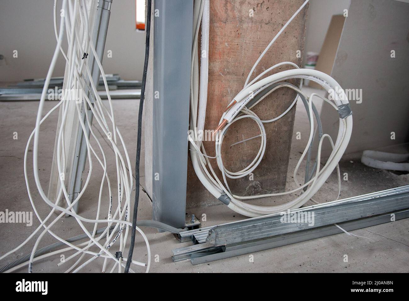 Closeup shot of metal parring and electrical wires on the wall of a ...