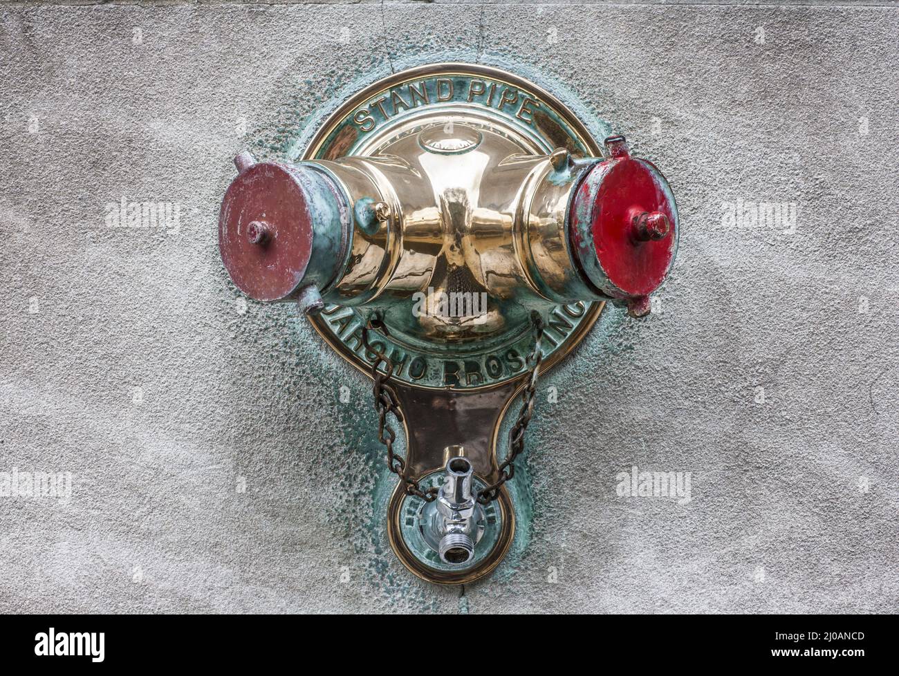 Fire hydrant on a building Stock Photo - Alamy