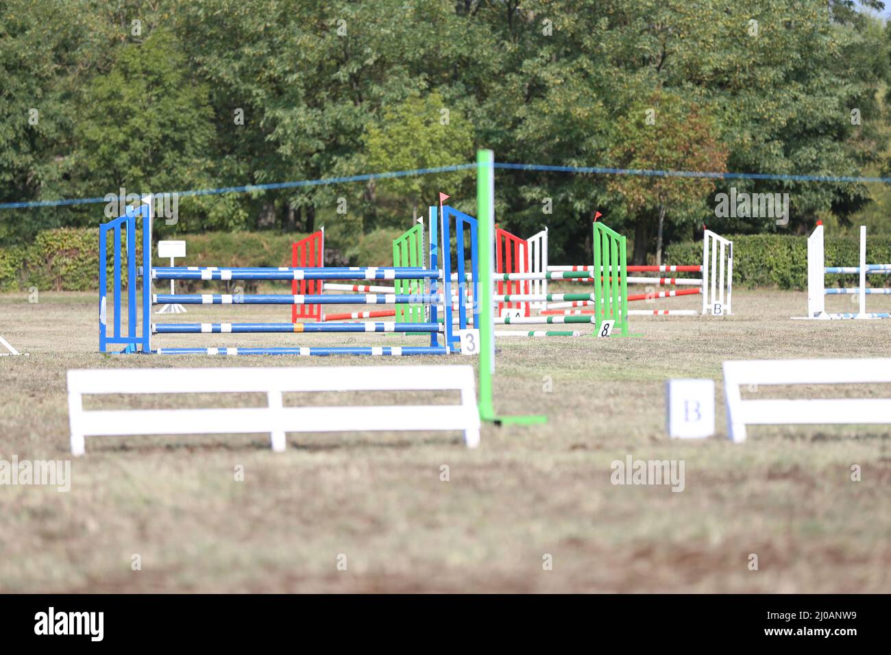 Show jumping poles obstacles, barriers, waiting for riders on show ...