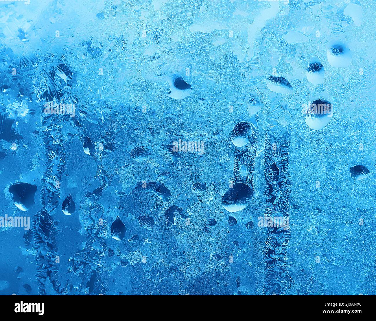 Frozen water drops on winter glass Stock Photo - Alamy