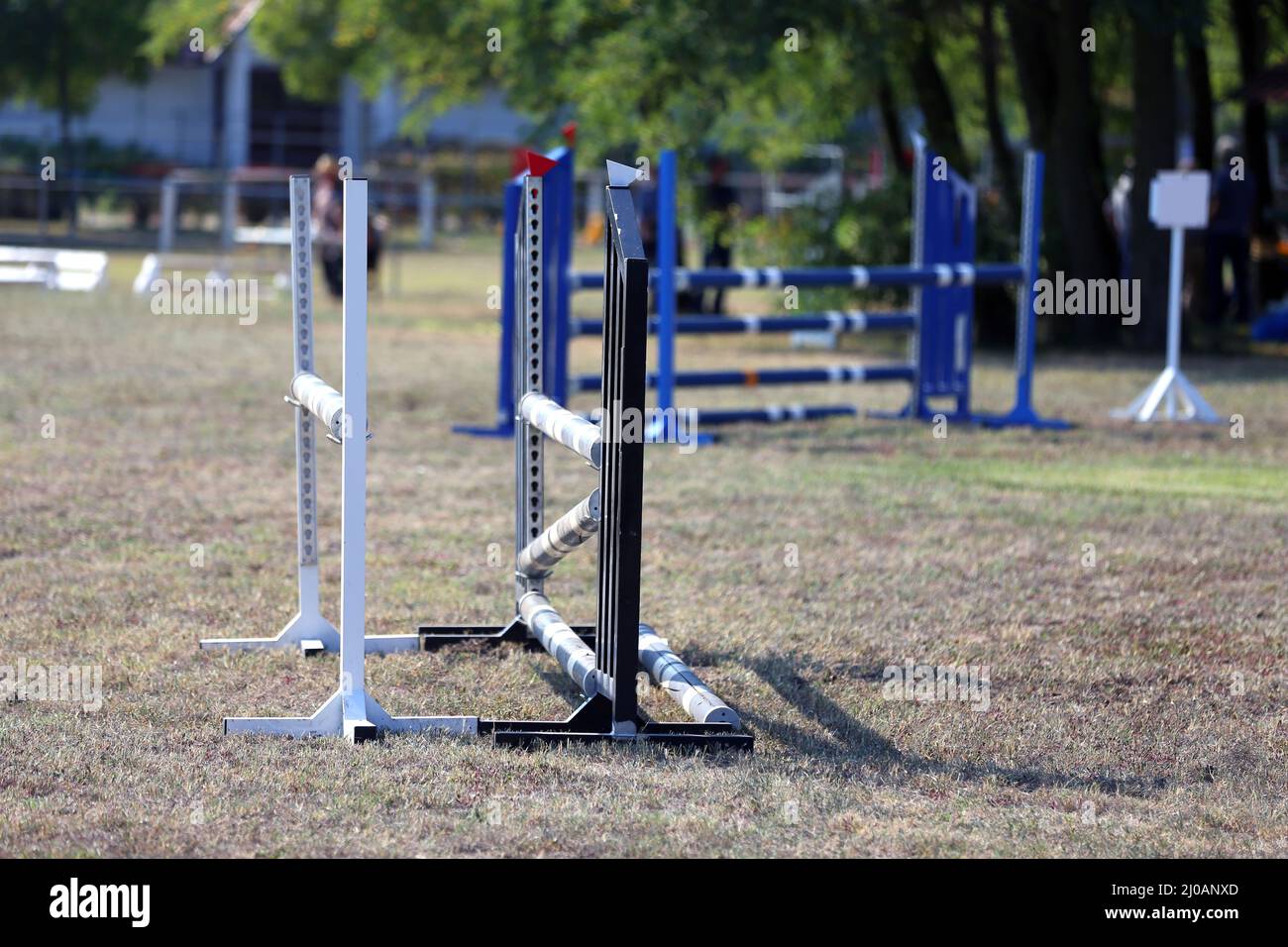 Show jumping poles obstacles, barriers, waiting for riders on show ...