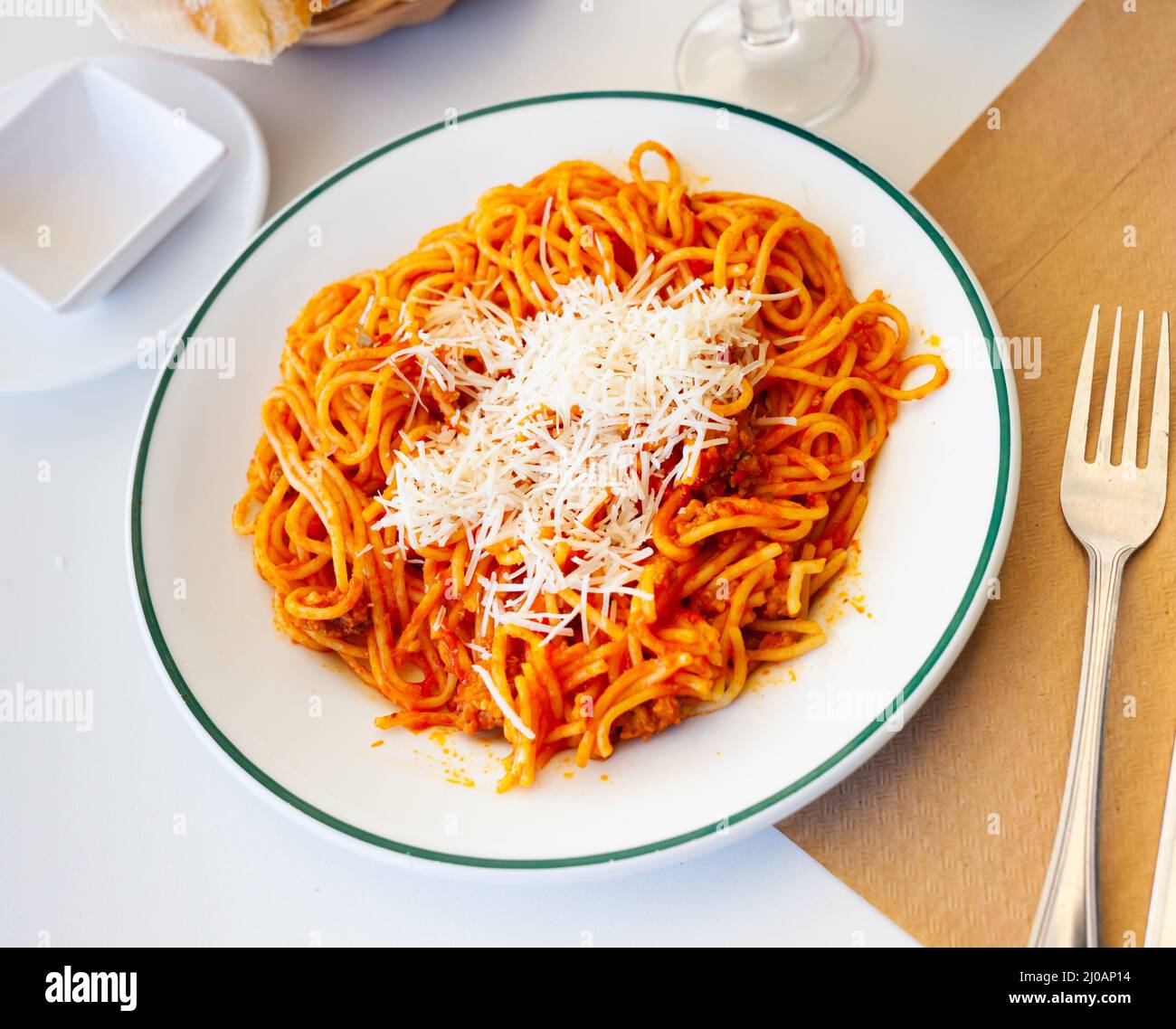 Italian spaghetti bolognese with grated cheese for dinner Stock Photo ...