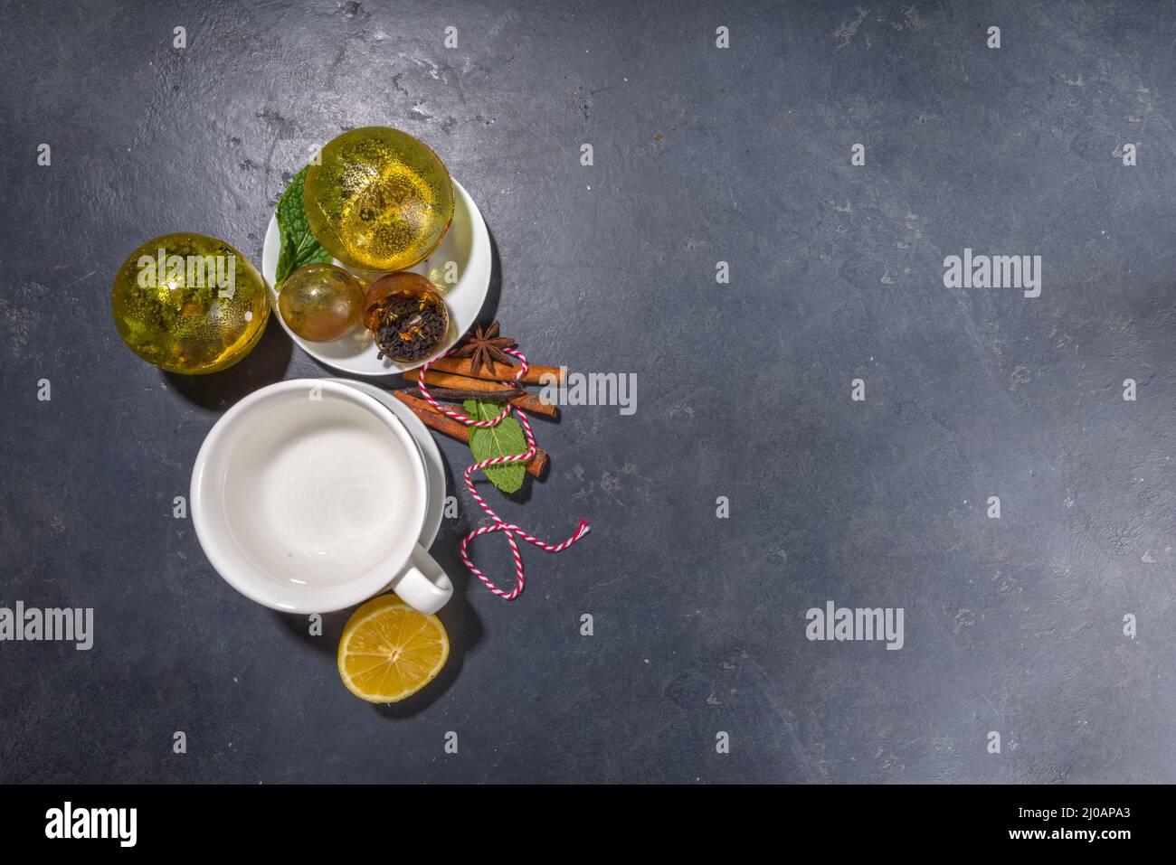 Making tea with Trendy modern tea ball bombs. Tea balls with dried tea ...