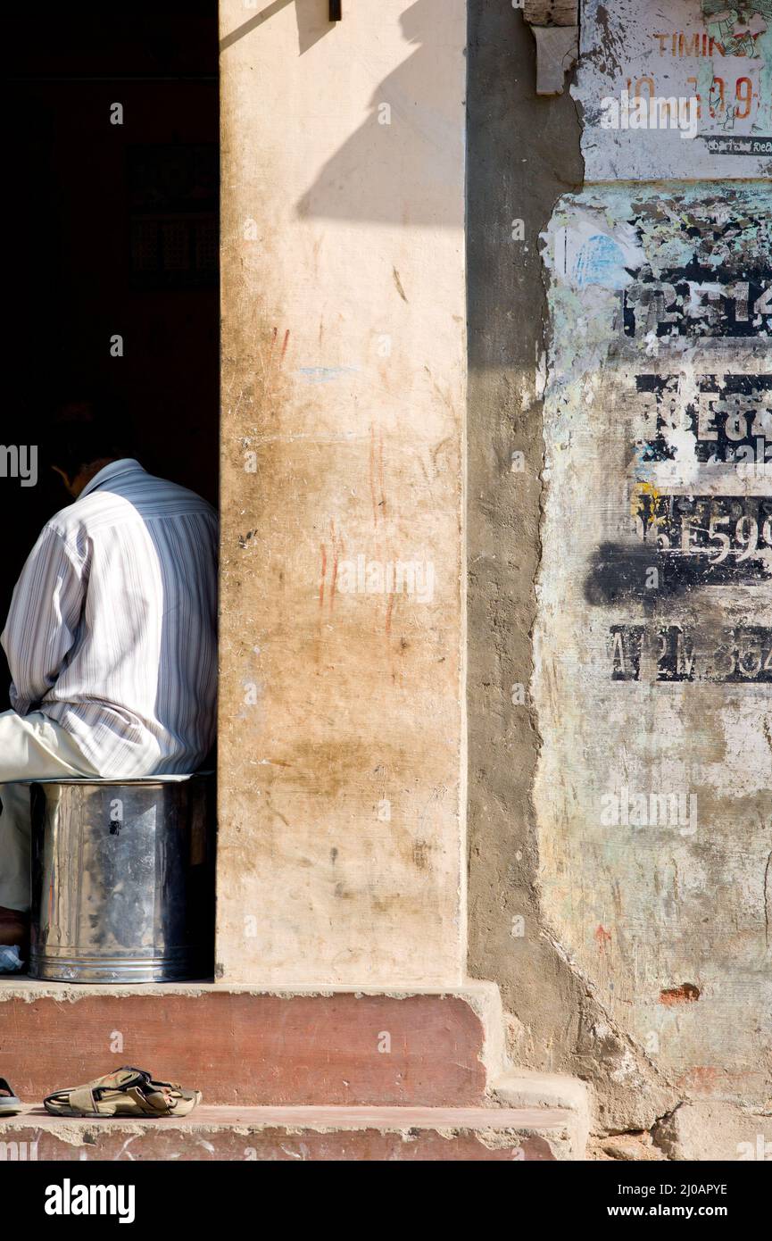 Man on a can Stock Photo - Alamy