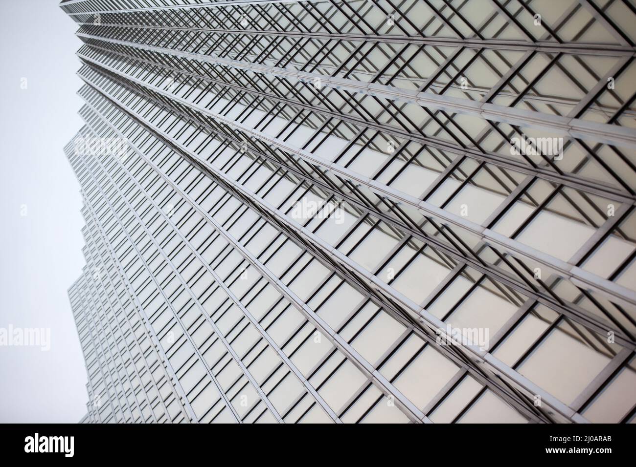 Low angle shot of a tall commercial building with steel frames Stock ...