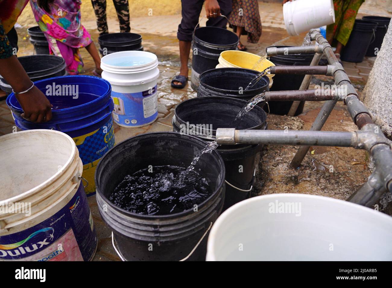 Indian Villagers Collects Drinking water from a road side water tap on ...