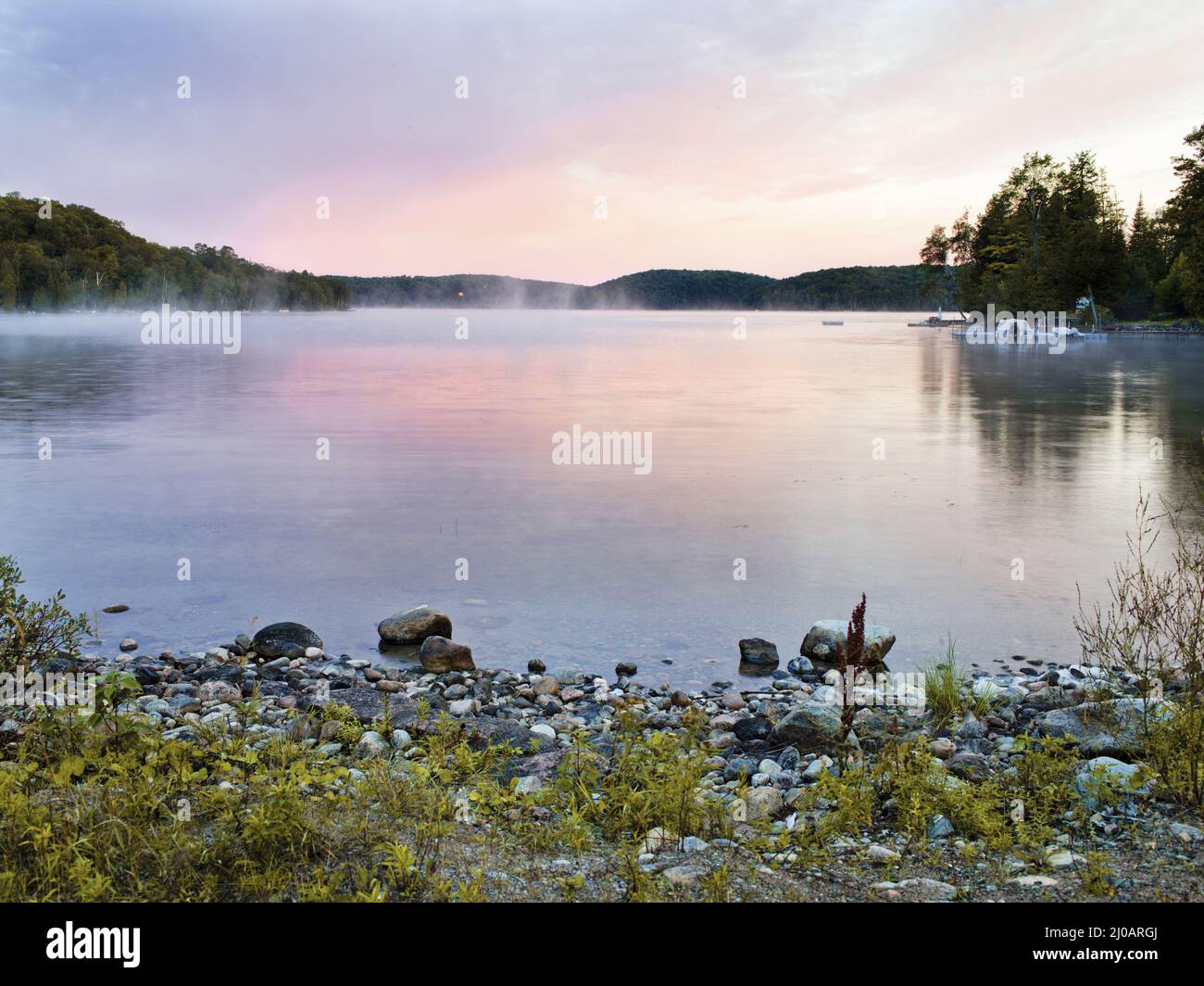 Mist rising off lake Stock Photo - Alamy