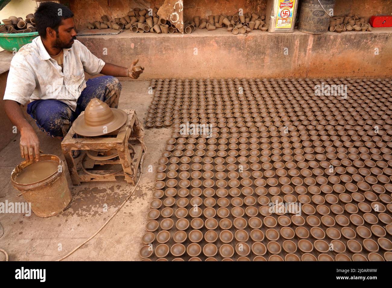 An Indian Potter Makes Earthen Lamps for the upcoming Diwali festival ...