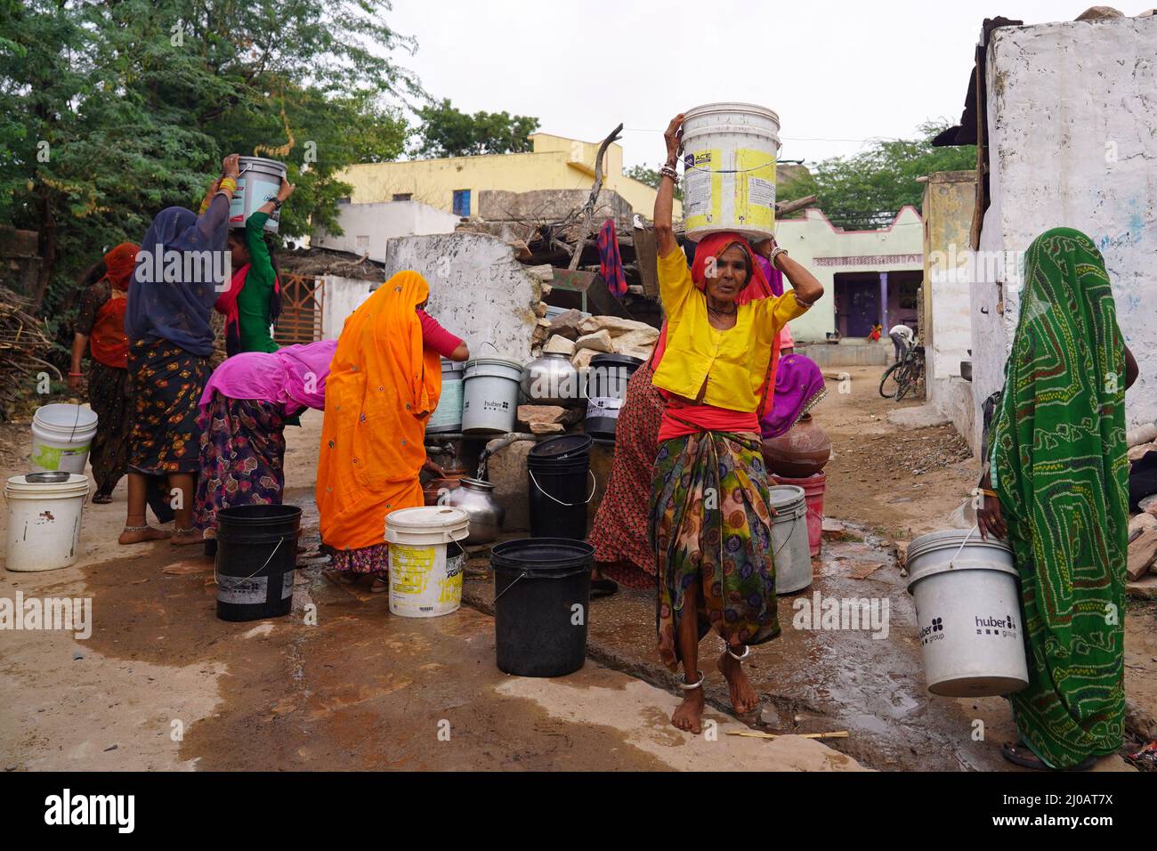Indian Villagers Collects Drinking water from a road side water tap on ...