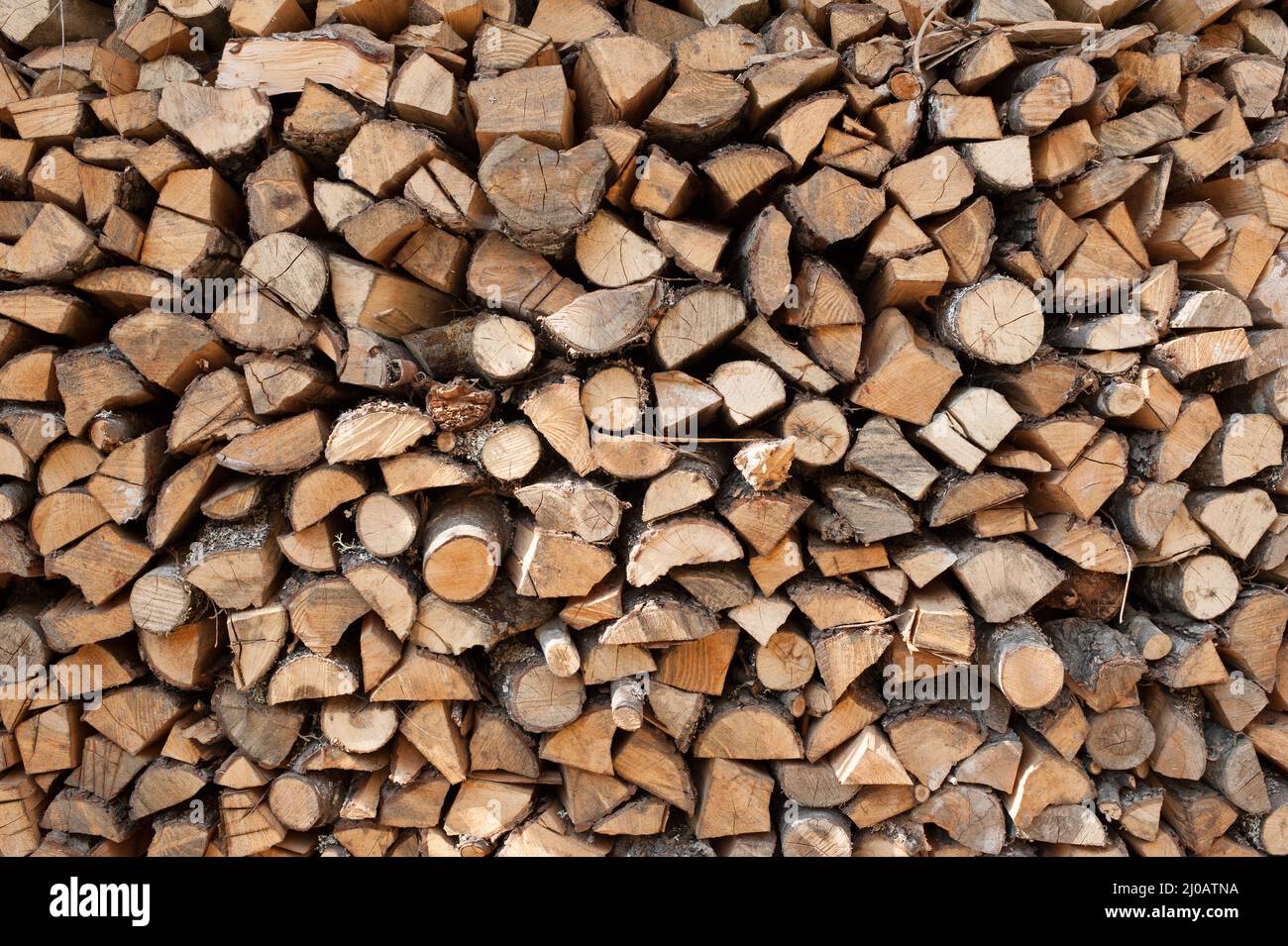 stack of fire wood. Wood stack background texture Stock Photo - Alamy