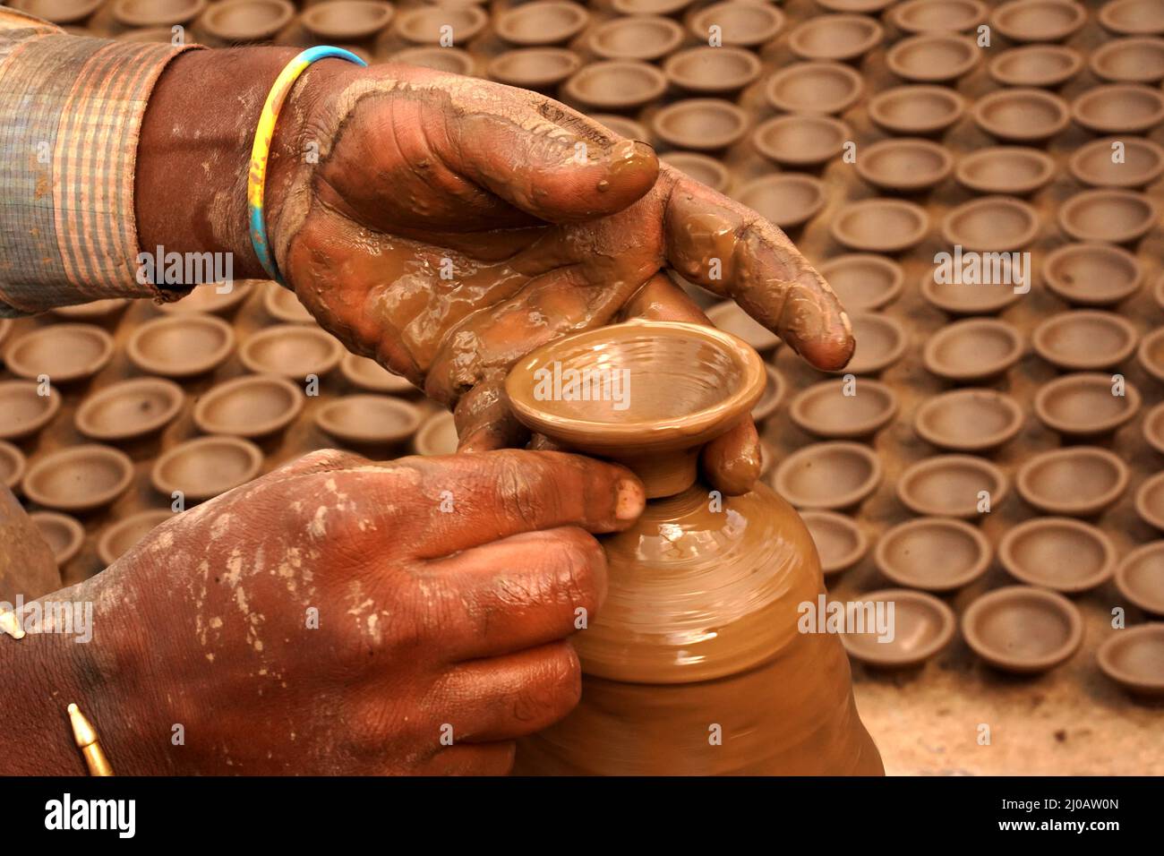 An Indian Potter Makes Earthen Lamps for the upcoming Diwali festival ...