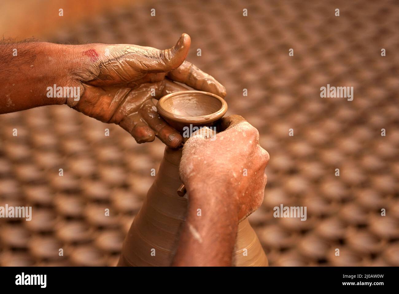 An Indian Potter Makes Earthen Lamps for the upcoming Diwali festival ...