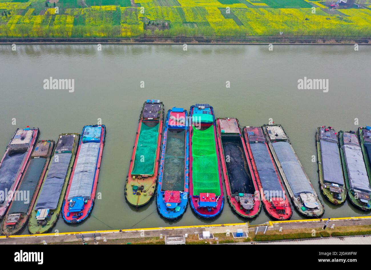 RUGAO, CHINA - MARCH 18, 2022 - Cargo ships are charged by shore ...