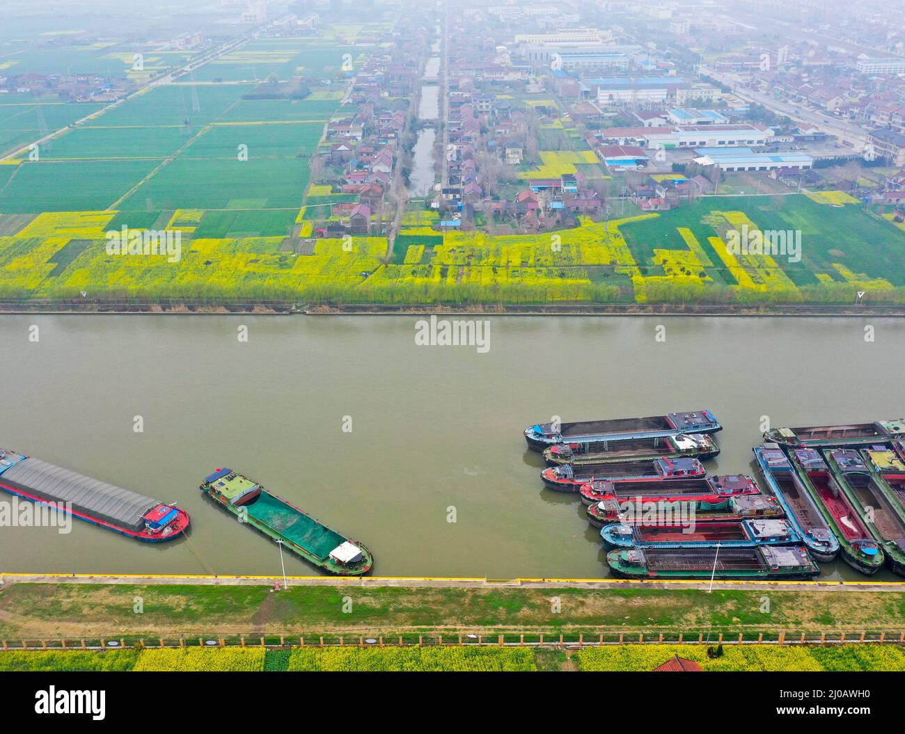 RUGAO, CHINA - MARCH 18, 2022 - Cargo ships are charged by shore ...