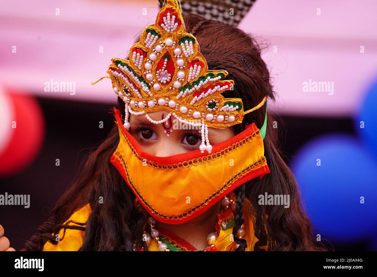 Indian Child wear face mask, Dressed As Hindu Lord Krishna, During The ...