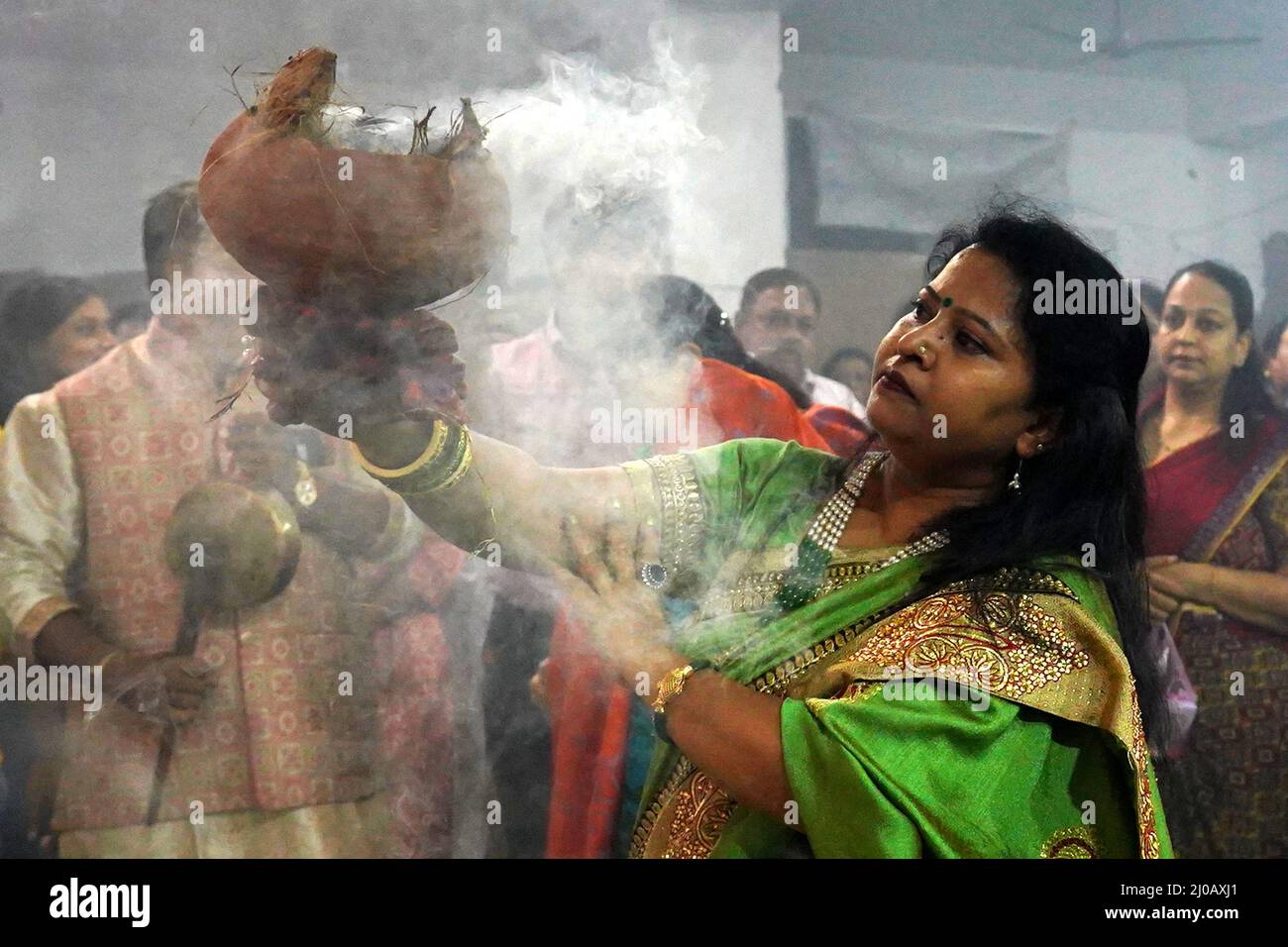 Hindu devotee performs a traditional Dhunuchi dance inside a temporary ...