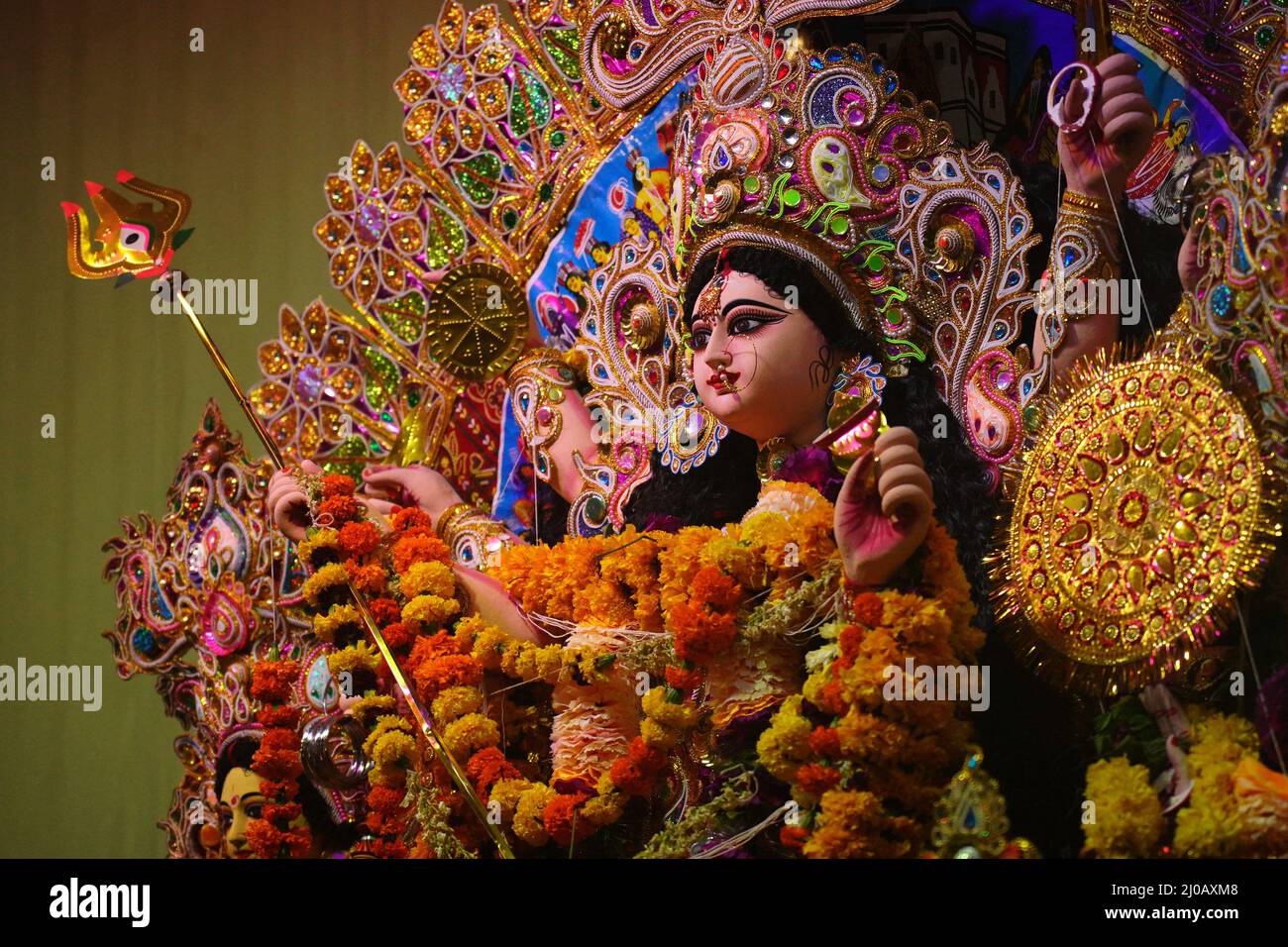 Indian People Perform Rituals in front of an idol of the Goddess Durga ...