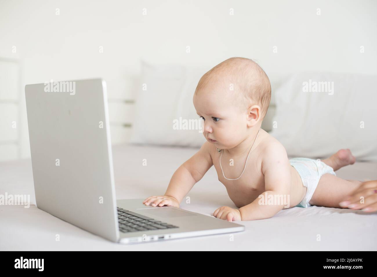 A baby and a computer, head shot laptop Stock Photo - Alamy