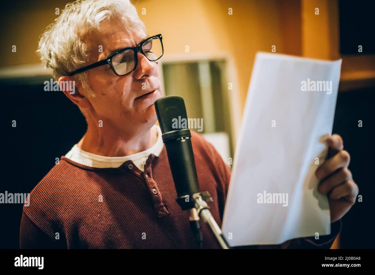 Behind the scene. Famous alternative male singer practice singing on ...