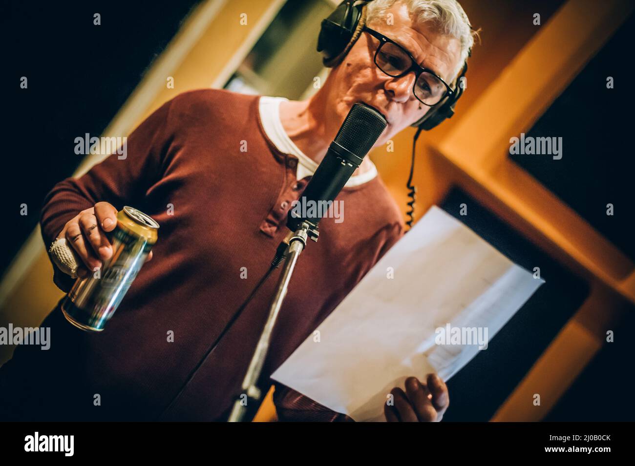 Behind the scene. Famous alternative male singer practice singing on ...