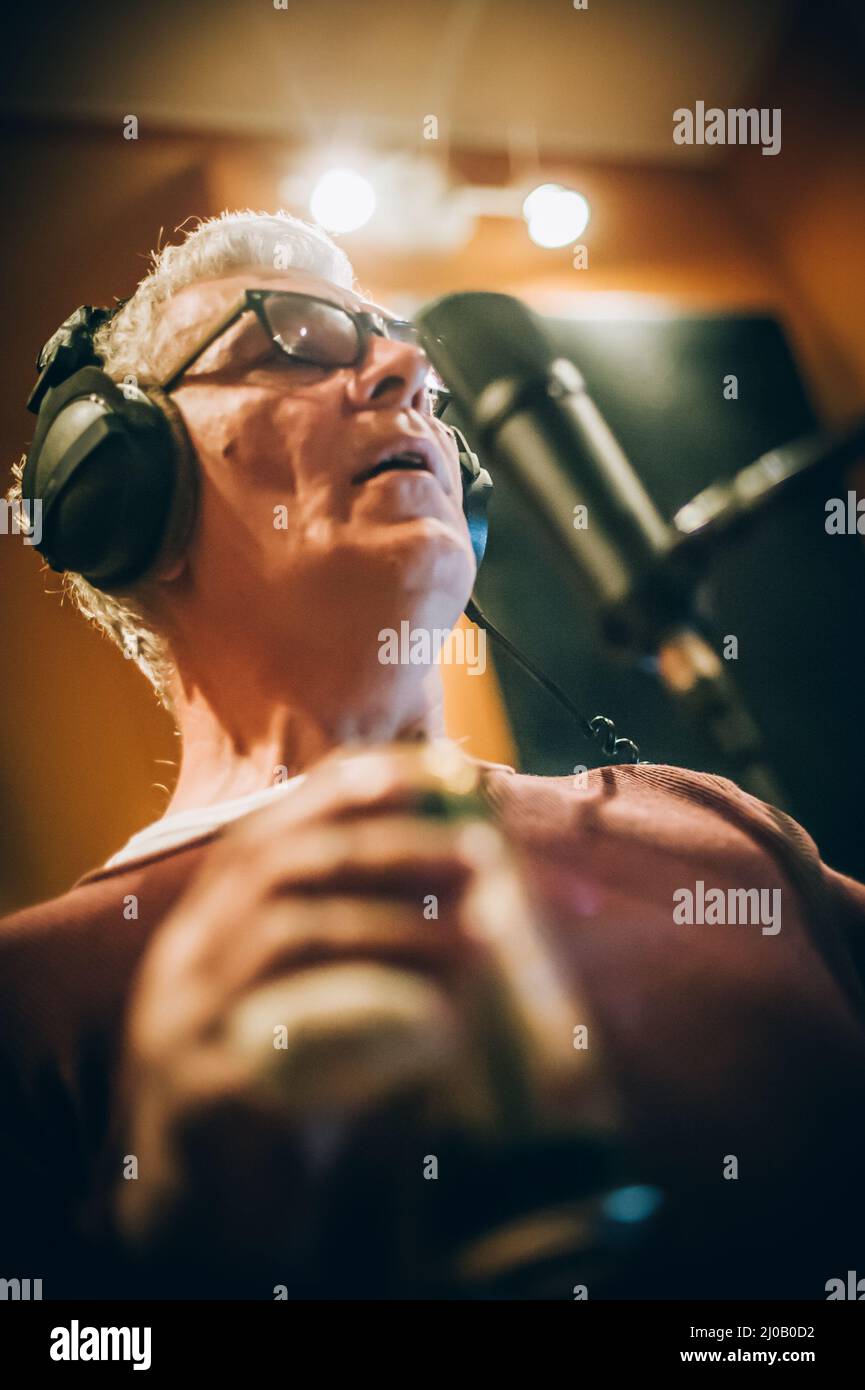 Behind the scene. Famous alternative male singer practice singing on ...