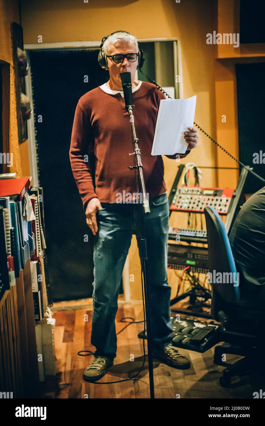 Behind the scene. Famous alternative male singer practice singing on ...