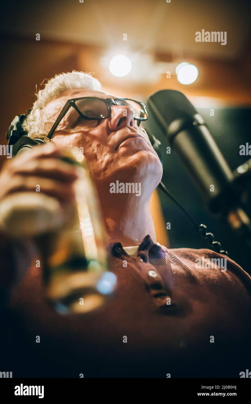 Behind the scene. Famous alternative male singer practice singing on ...