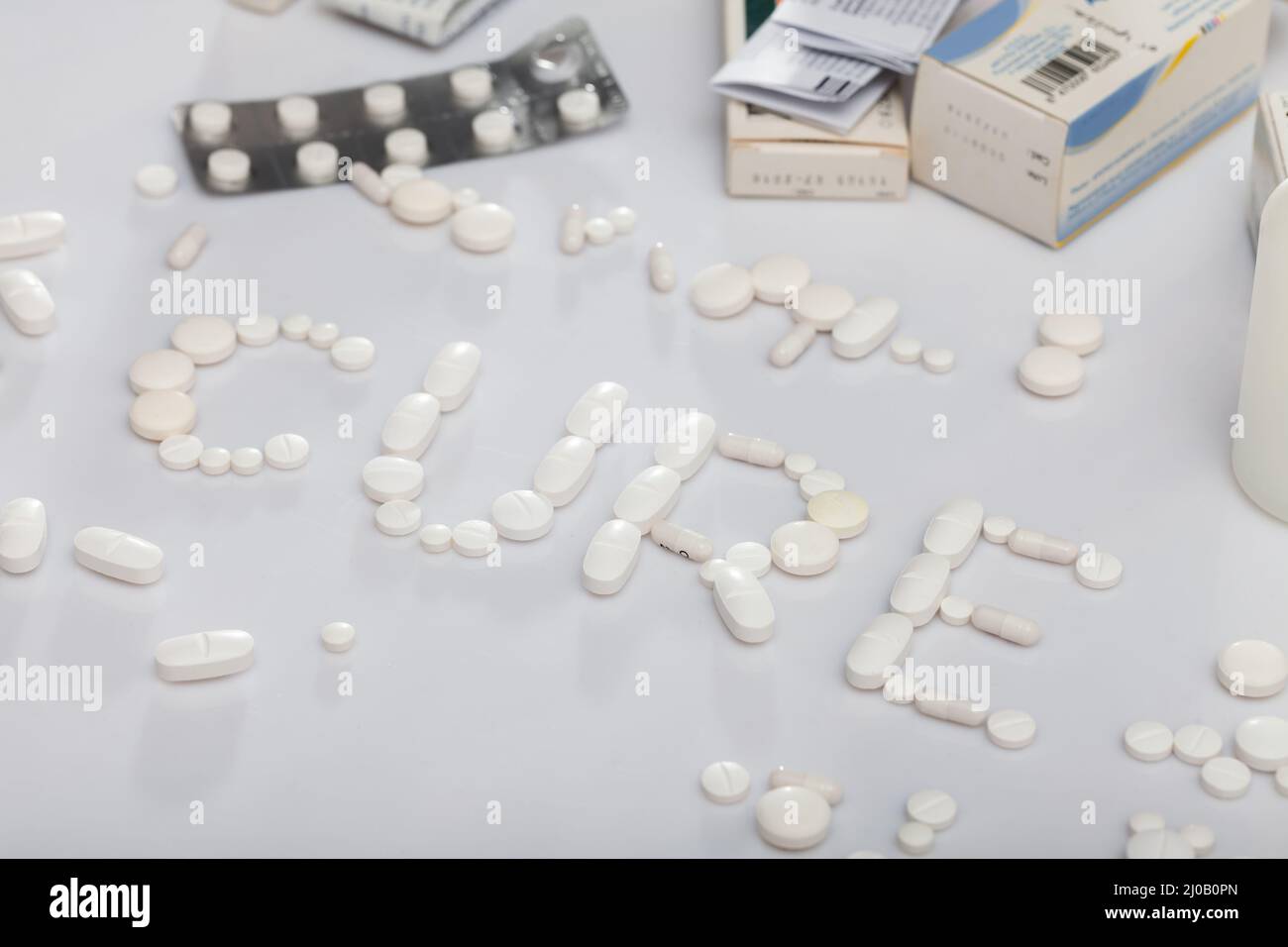 Word CURE made of medicine pills Stock Photo - Alamy