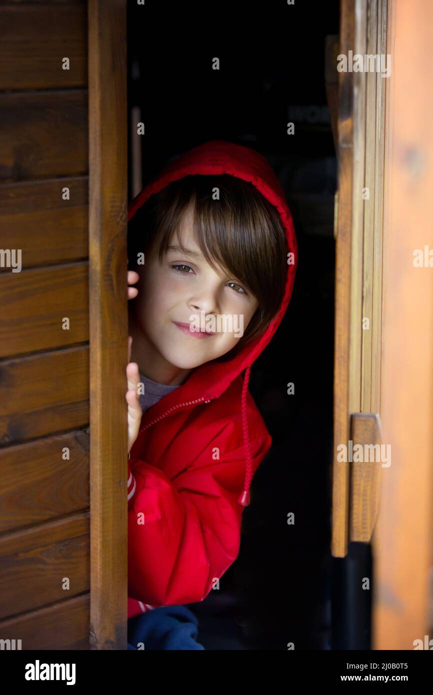 Children hiding in wardrobe hi-res stock photography and images - Alamy