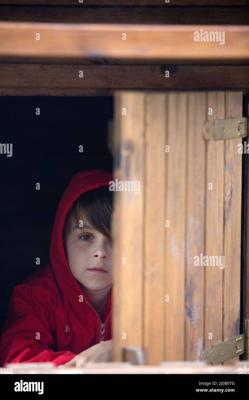 Children hiding in wardrobe hi-res stock photography and images - Alamy