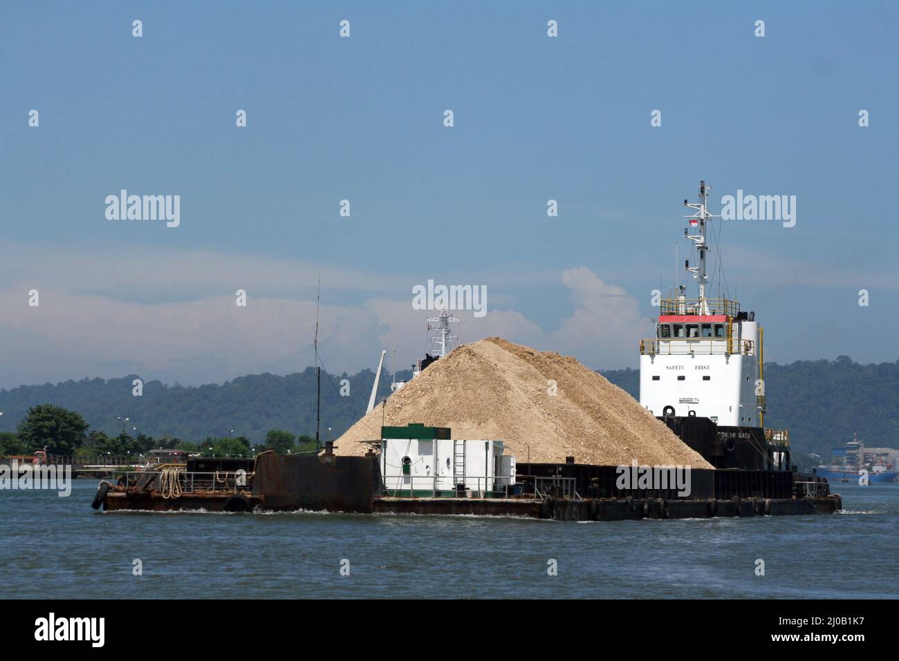 ship carrying sand around the sea waters of Cilacap, Central Java ...