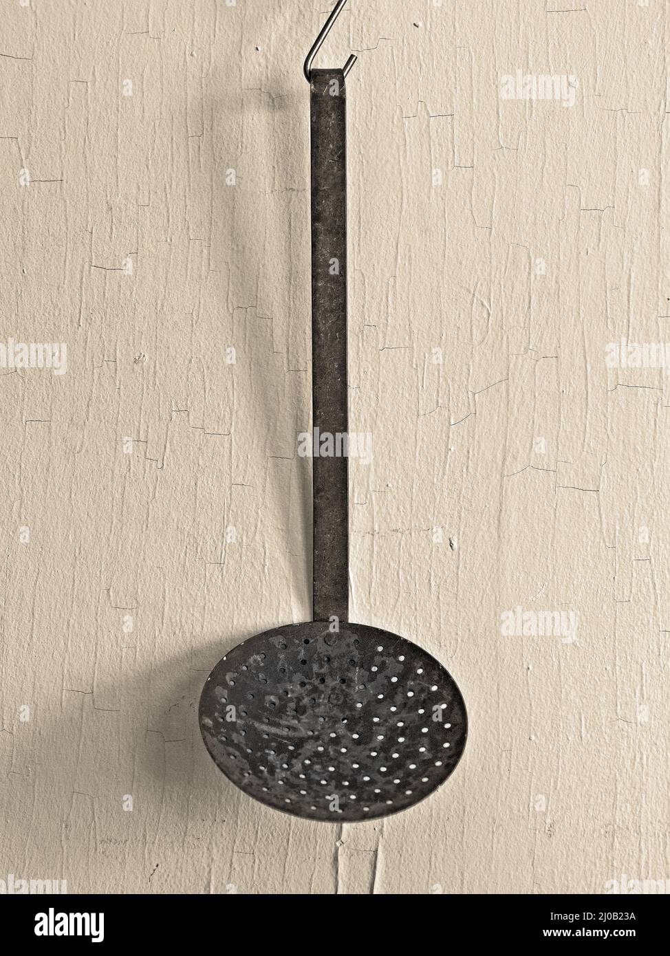 Vintage skimmer ladle Stock Photo - Alamy